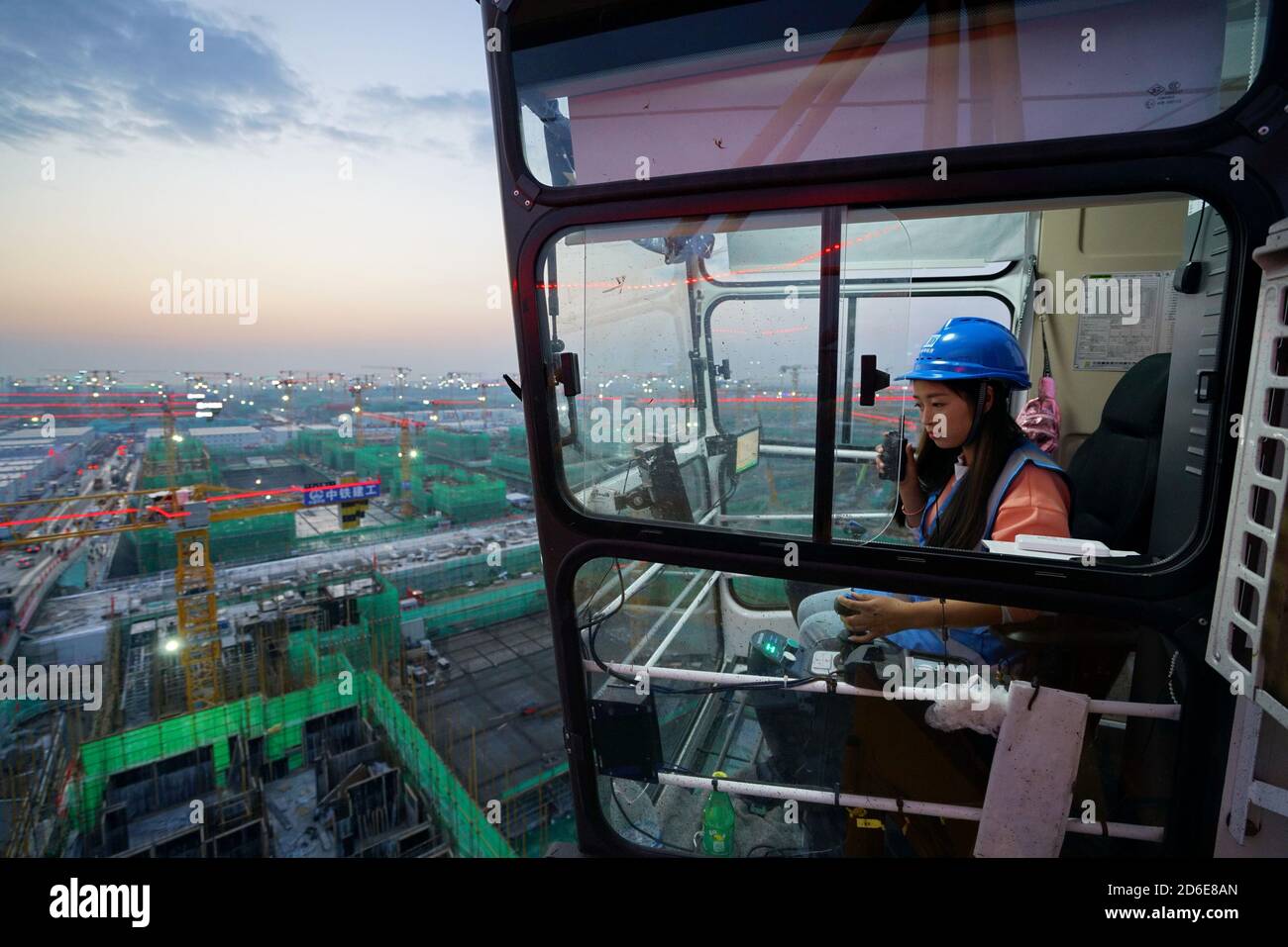 Xiongan. 24th Sep, 2020. Tower crane driver Aluo Chunmei works at a ...