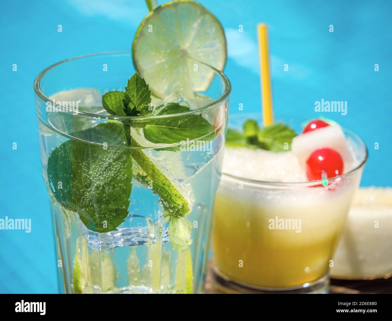 Two summer cocktails on a pool side Stock Photo - Alamy