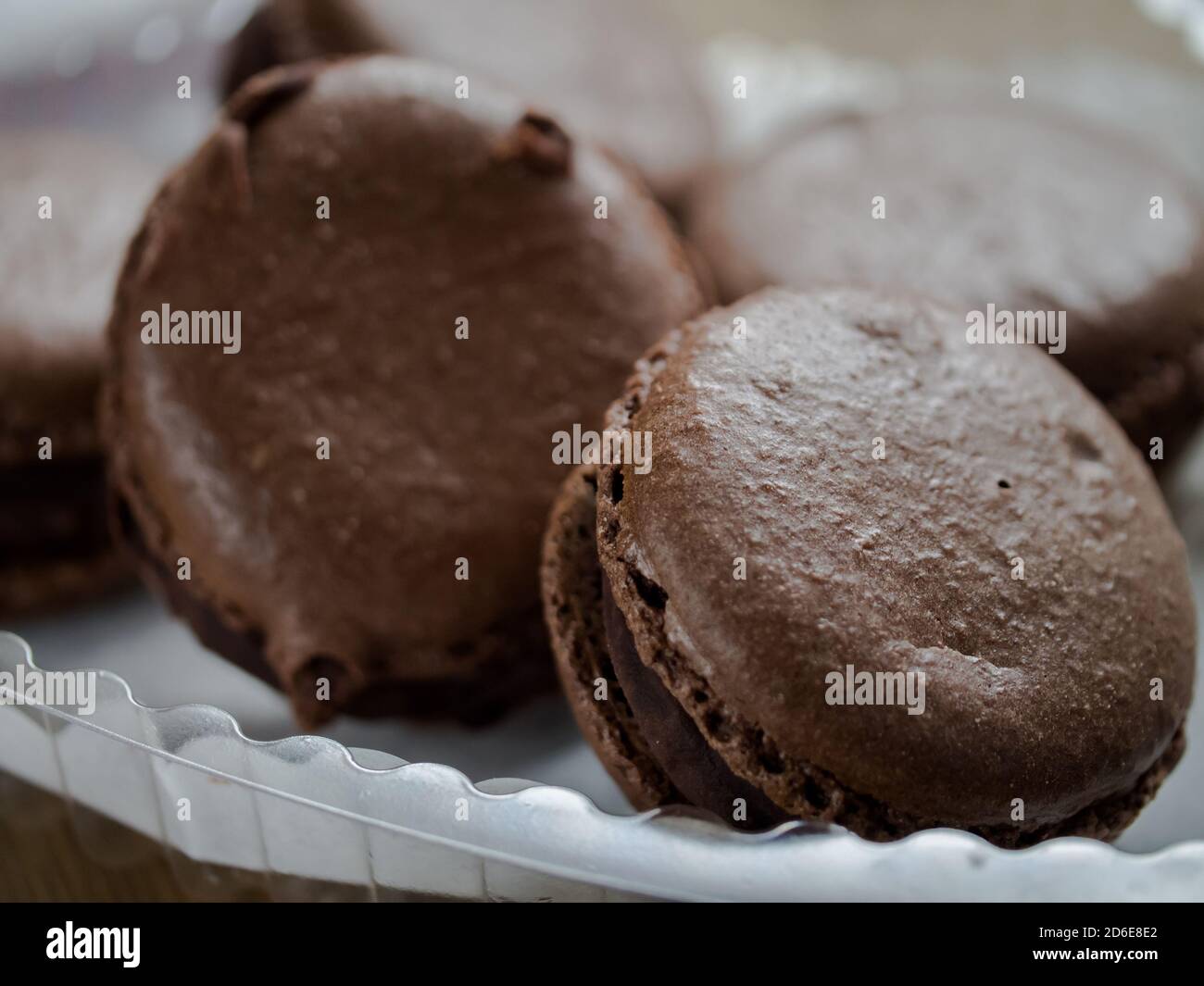 Fresh chocolate macaroons as a dessert Stock Photo - Alamy