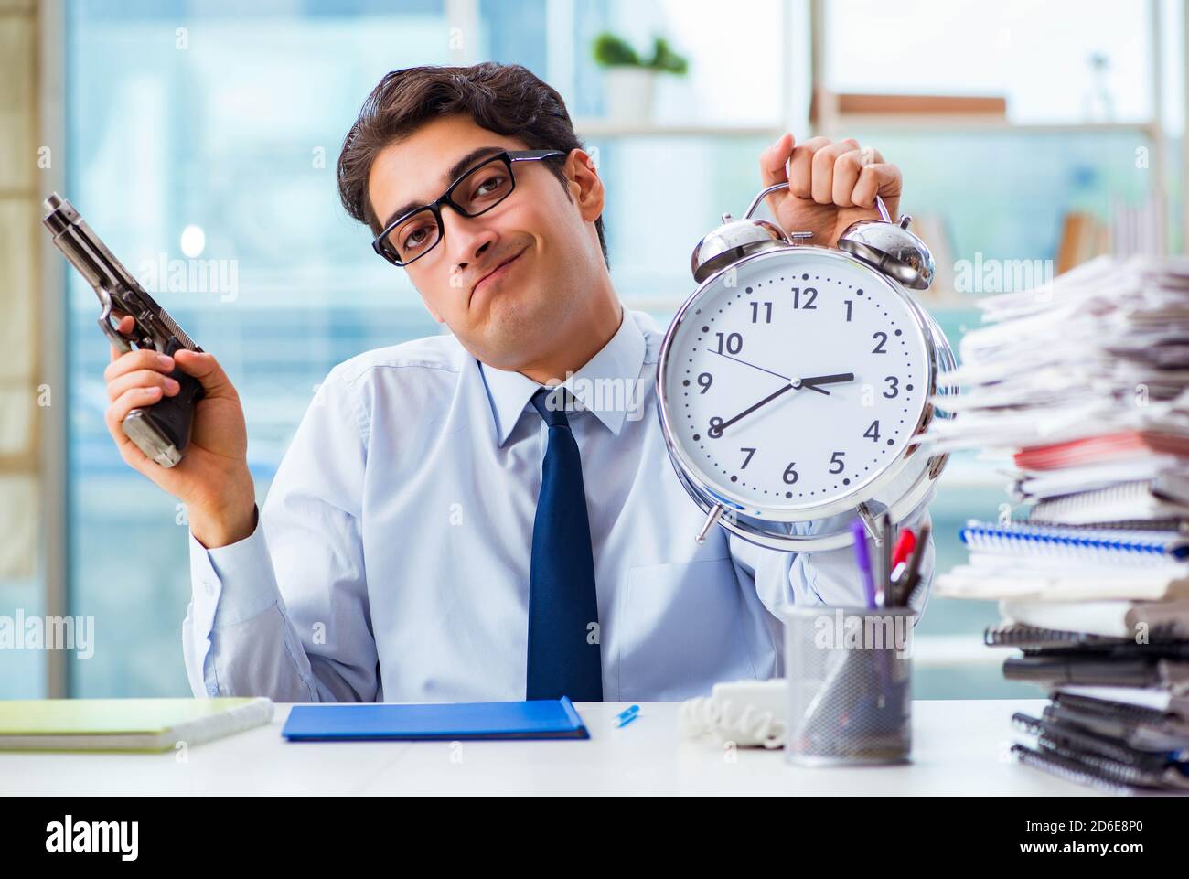 The angry businessman with gun thinking of committing suicide Stock ...