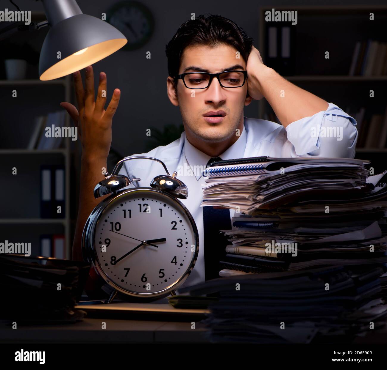 The young businessman working overtime late in office Stock Photo - Alamy