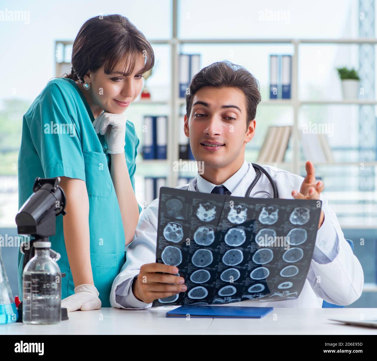 The two doctors discussing x-ray mri image in hospital Stock Photo - Alamy