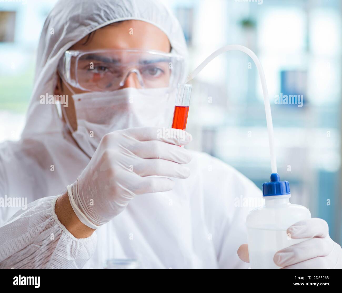 The chemist working in the laboratory with hazardous chemicals Stock ...
