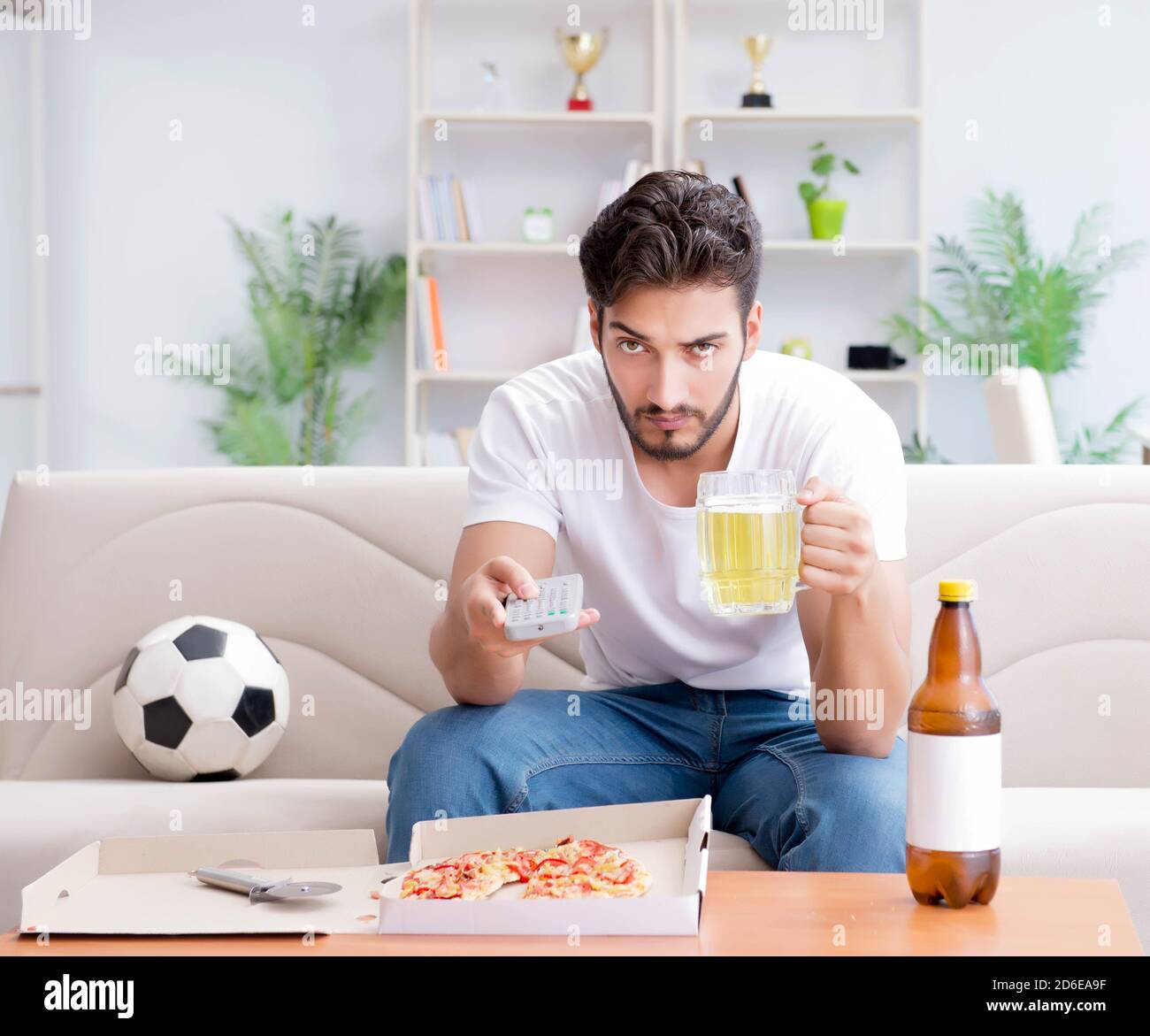 The man eating pizza having a takeaway at home relaxing resting Stock ...