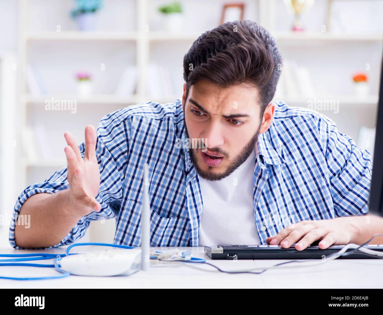 The frustrated young man due to weak internet reception Stock Photo - Alamy