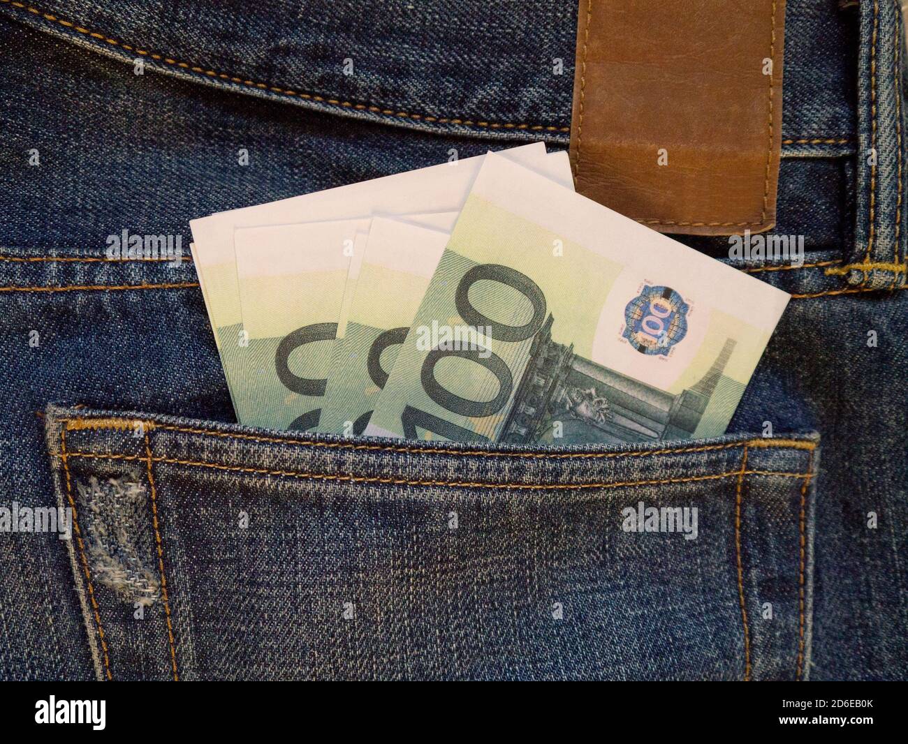One hundred euro notes in a back pocket Stock Photo - Alamy