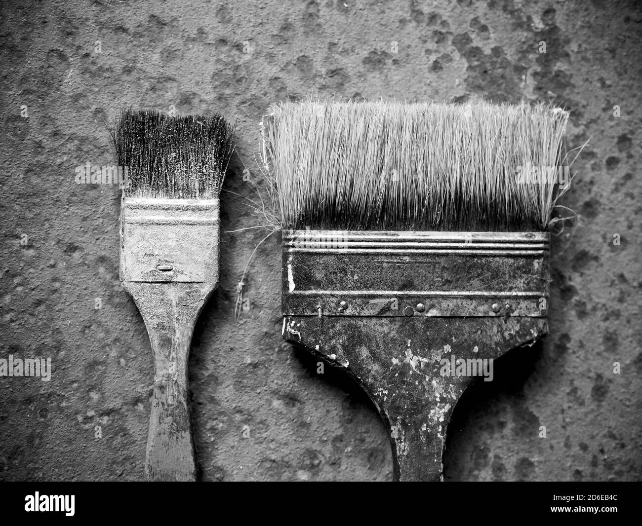 Old brushes over a rusty metal background Stock Photo - Alamy