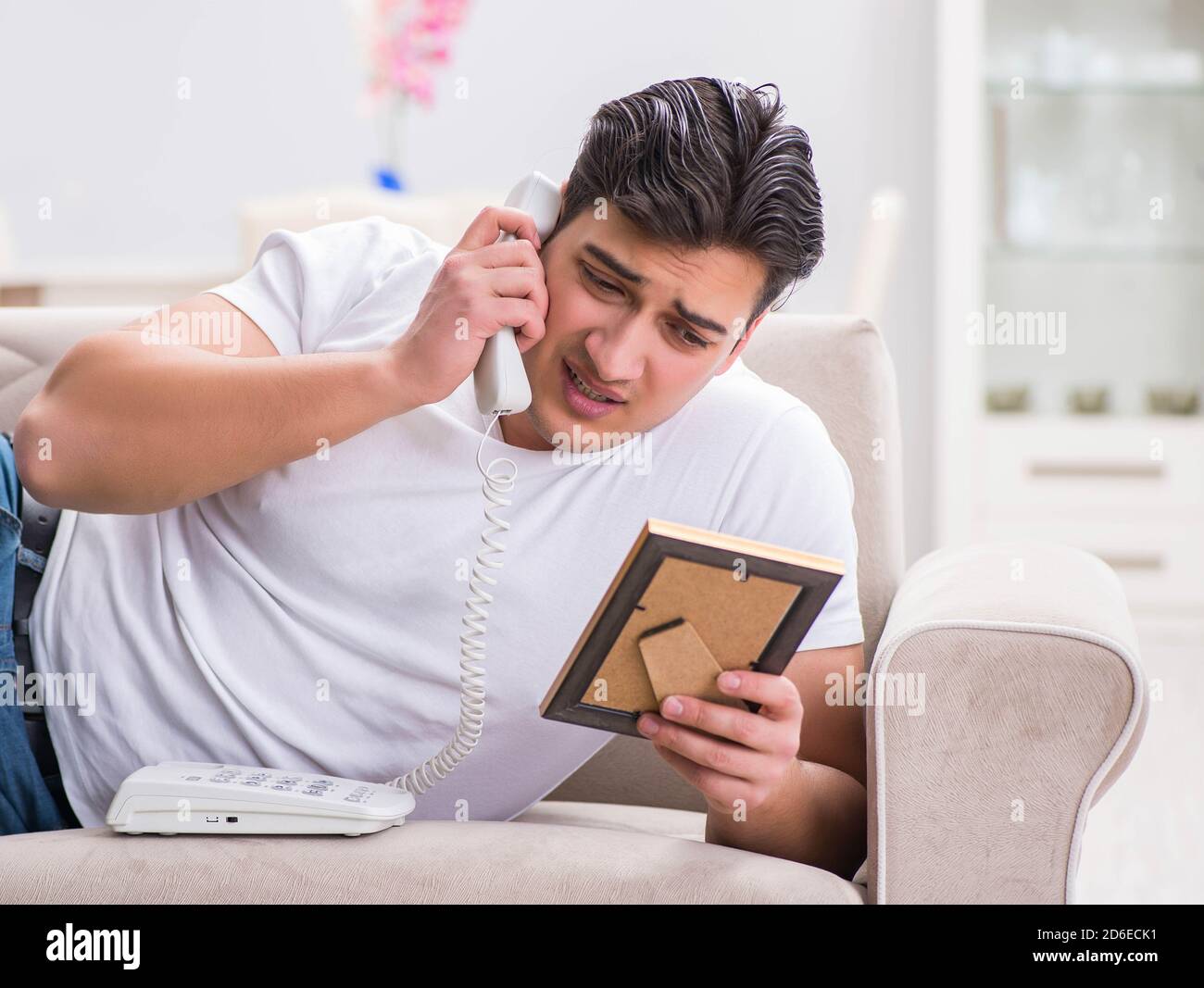 The young man in sad saint valentine concept Stock Photo - Alamy