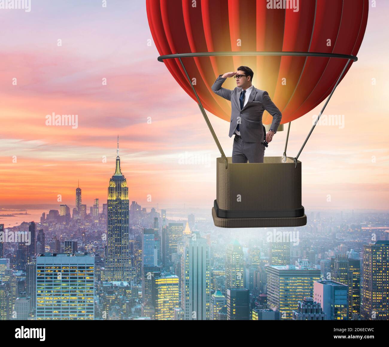 The businessman flying on balloon in challenge concept Stock Photo - Alamy