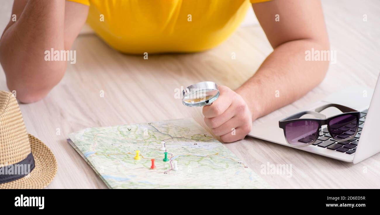 The man planning his vacation trip with map Stock Photo - Alamy