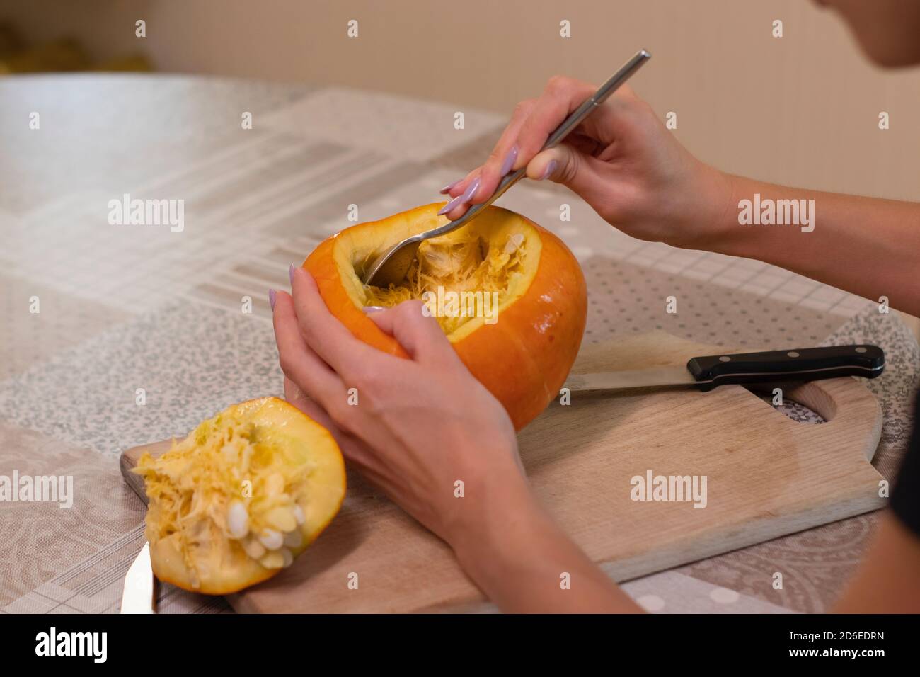 the process of making a Halloween pumpkin. cleansing of seeds by a ...