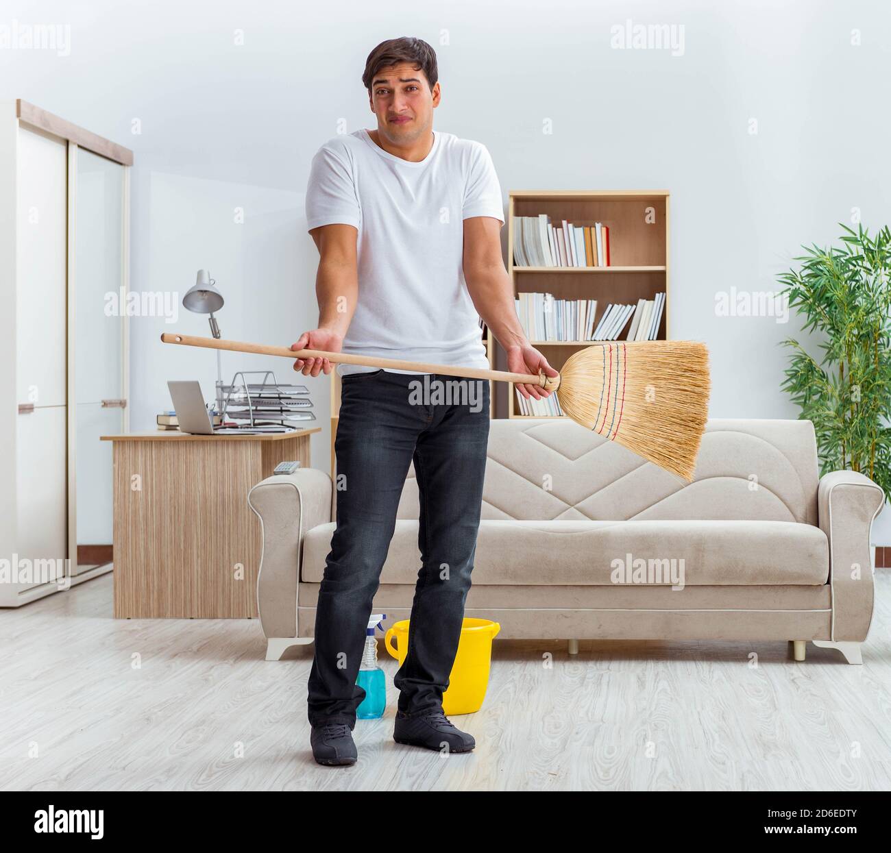 The man husband cleaning the house helping wife Stock Photo - Alamy