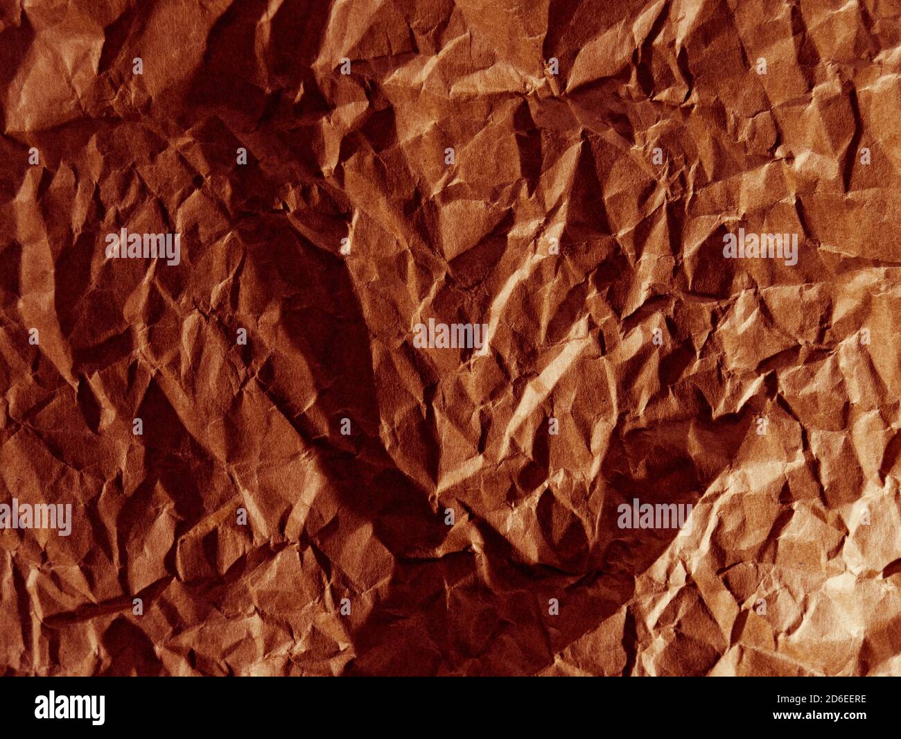 Brown wrinkled paper as a background Stock Photo - Alamy