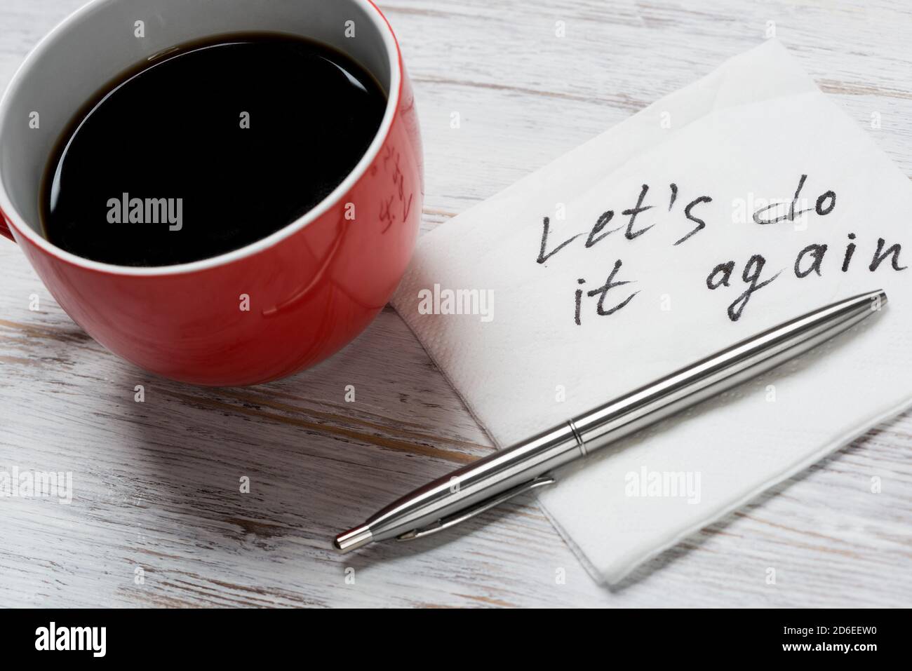 Let us do it again written on napkin Stock Photo - Alamy