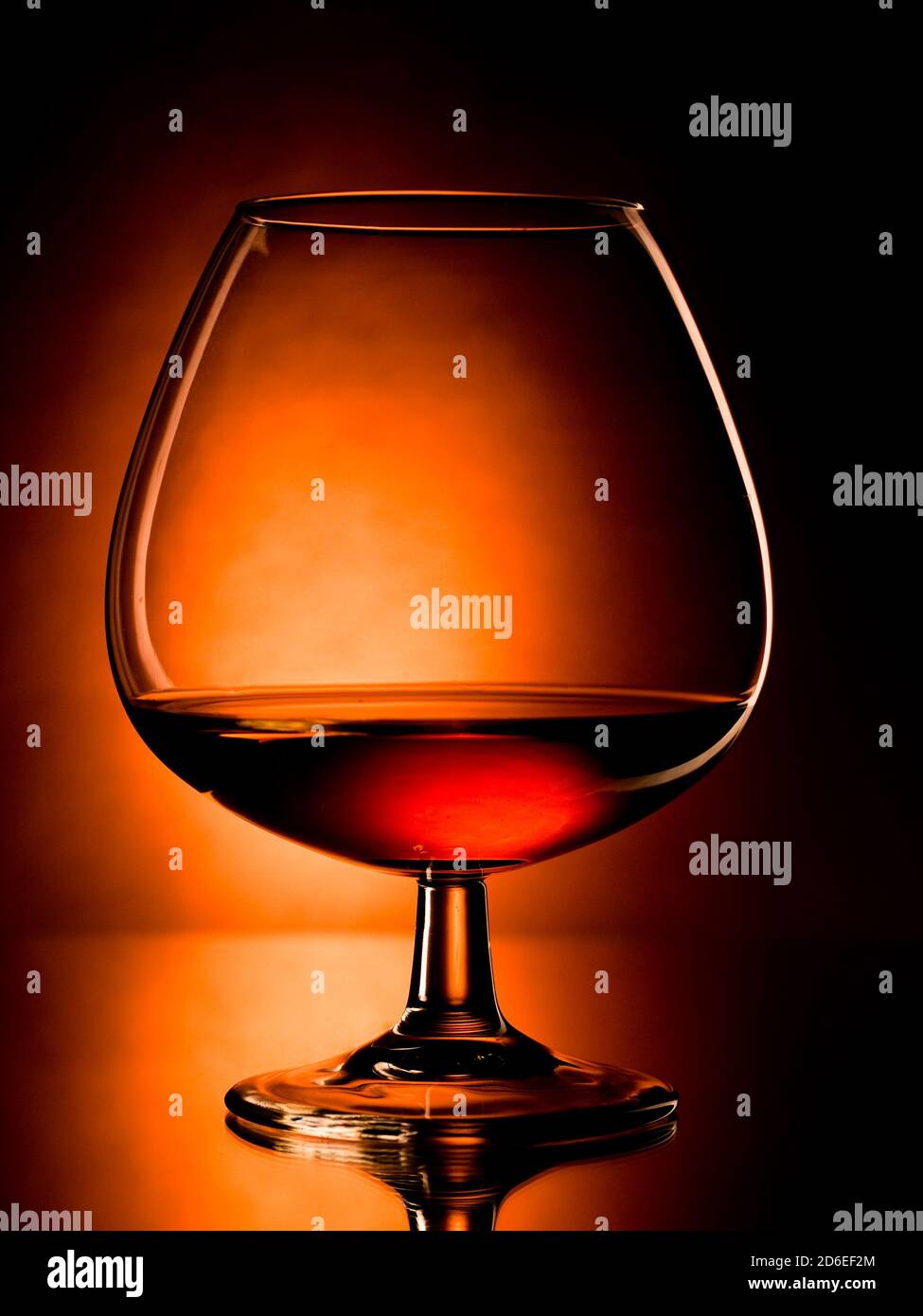 glass of cognac, dramatic light, vibrant colors Stock Photo - Alamy