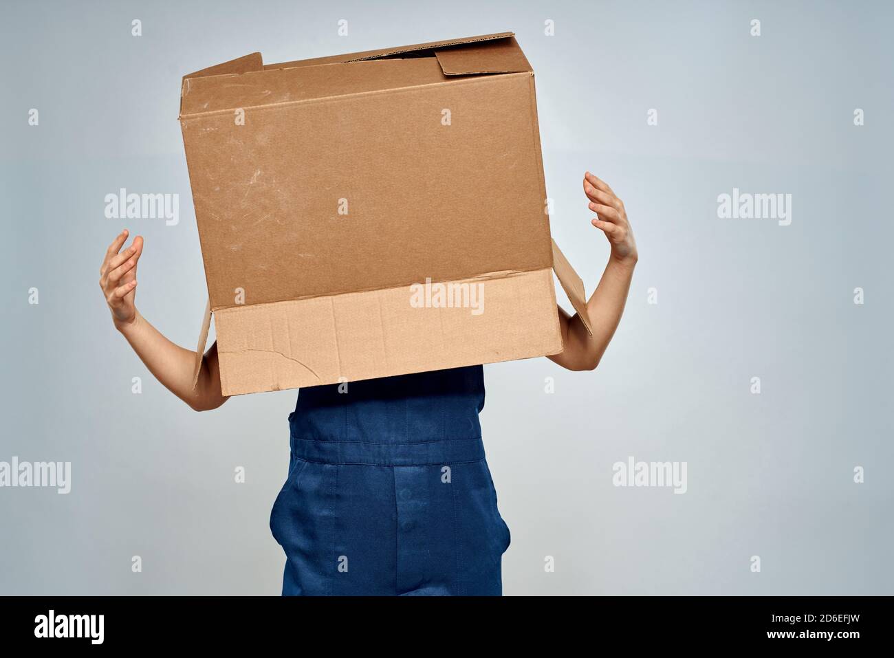 Woman in working uniform box packing service lifestyle Stock Photo - Alamy