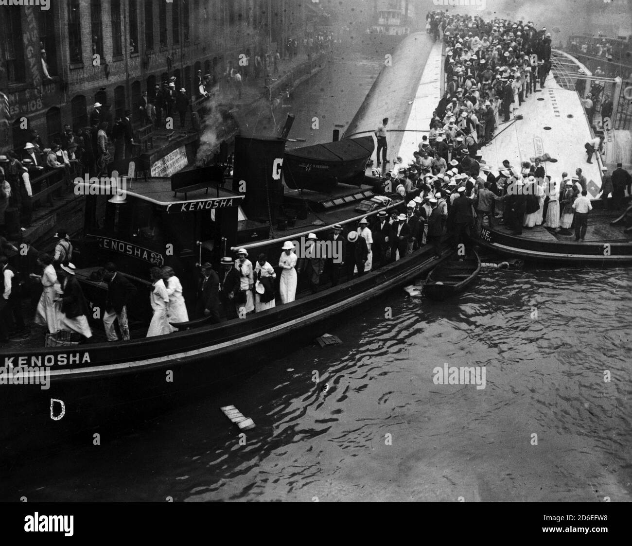 Survivors of the Eastland Disaster being led ashore by the tugboat ...