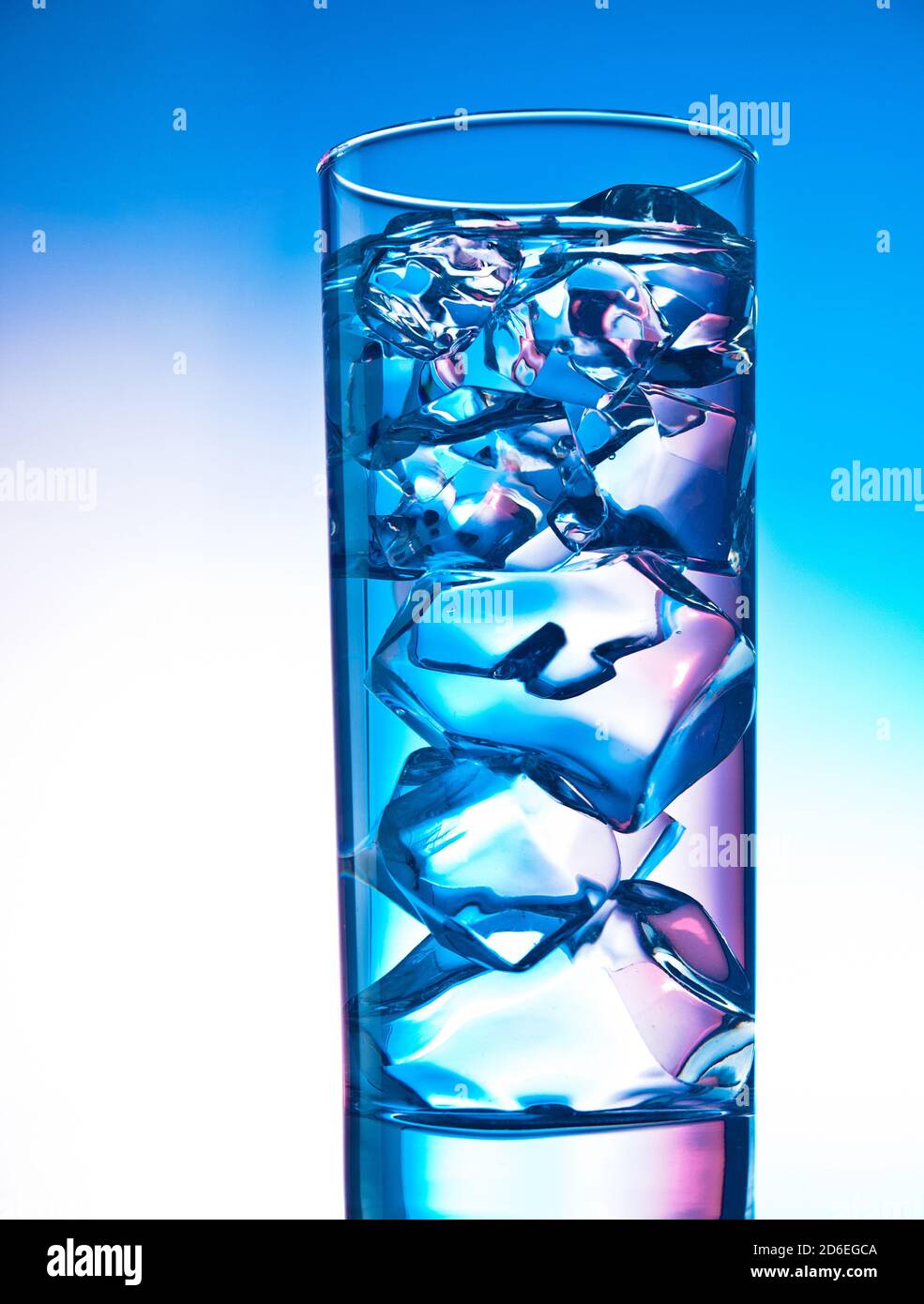 Glass of clear cocktail filled with ice cubes Stock Photo - Alamy