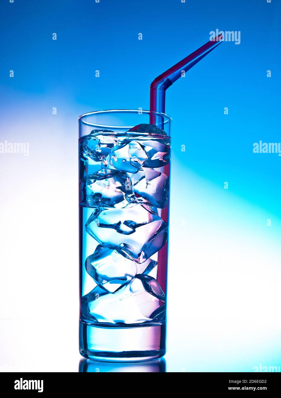 Glass of clear cocktail filled with ice cubes Stock Photo - Alamy