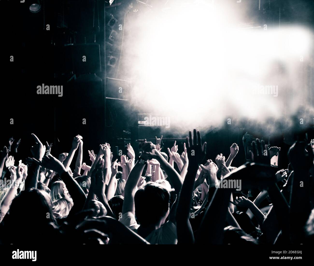Concert crowd, hands up, toned Stock Photo - Alamy