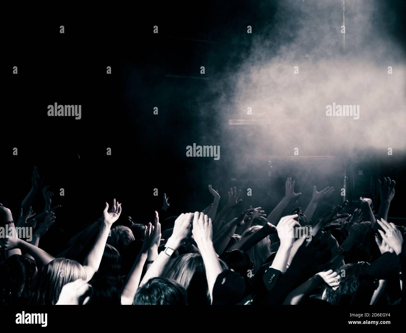 Concert crowd, hands up, toned Stock Photo - Alamy
