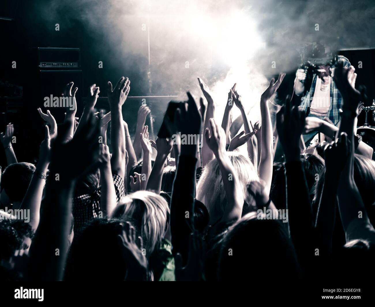 Concert crowd, hands up, toned Stock Photo - Alamy