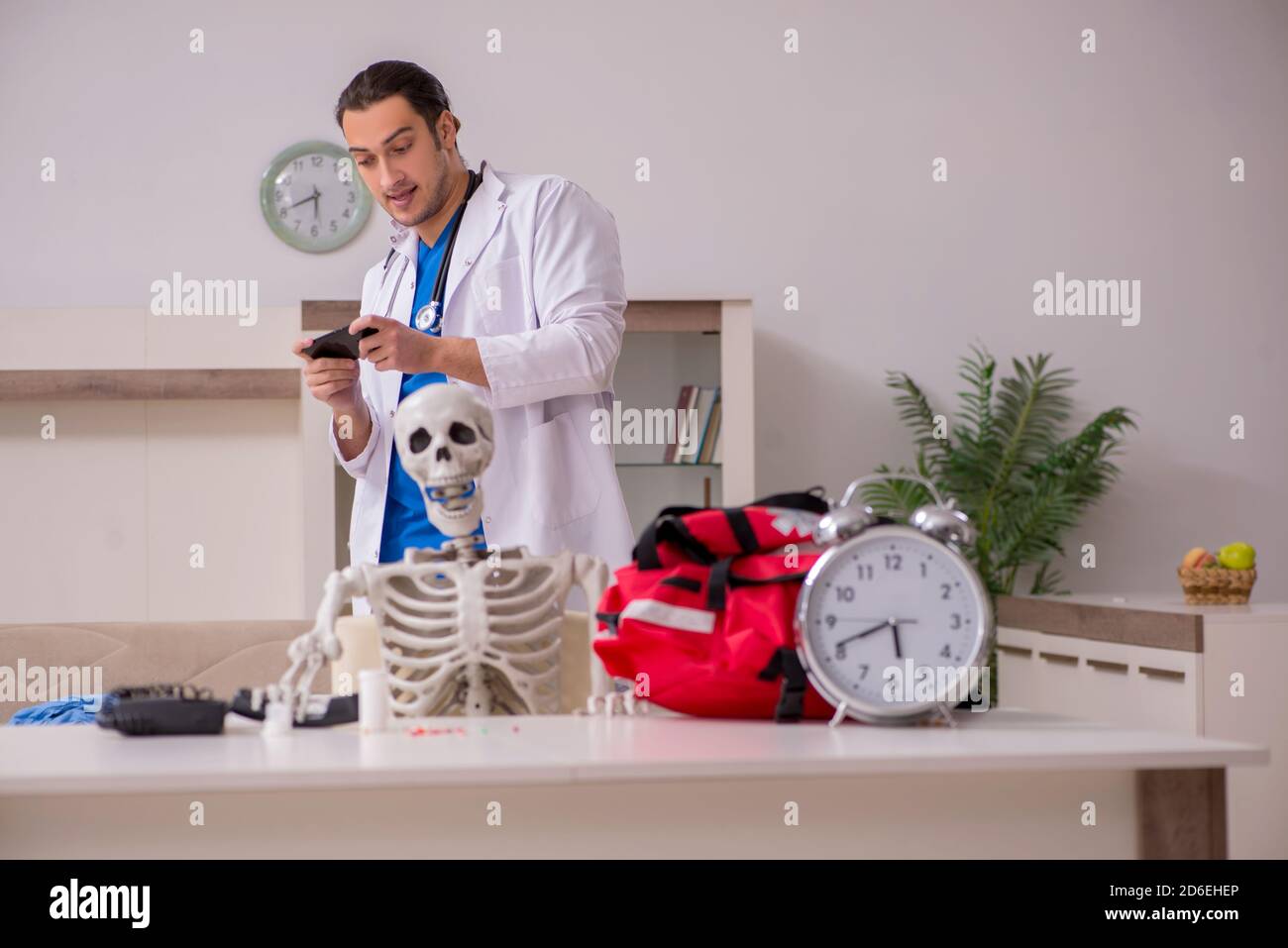 Male paramedic visiting skeleton patient Stock Photo - Alamy
