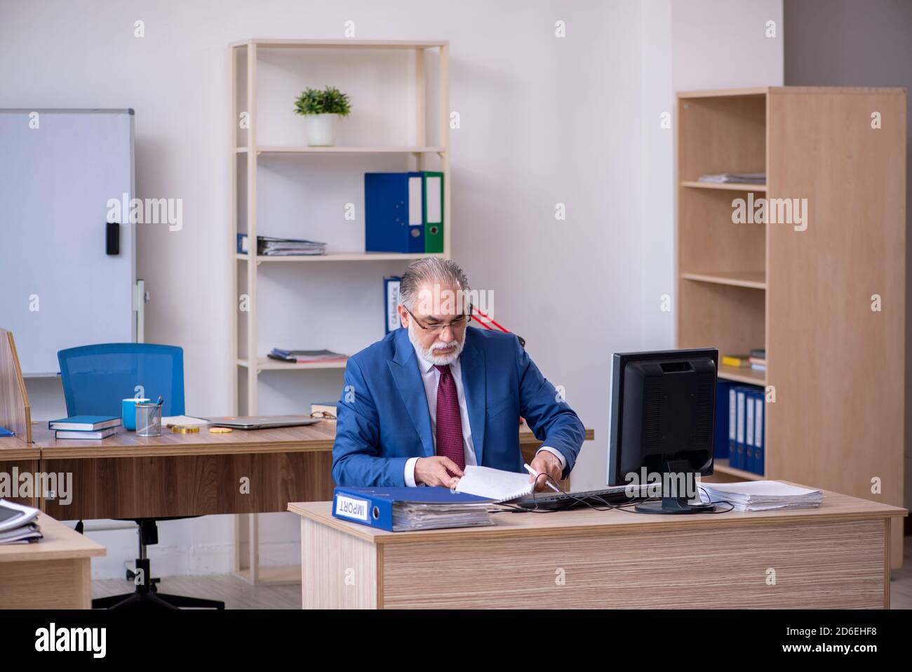 Male boss employee working in the office Stock Photo - Alamy