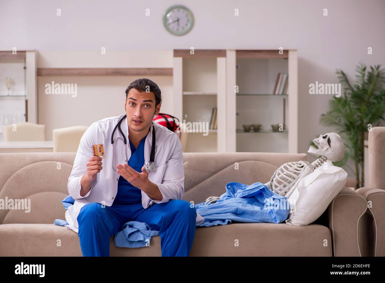 Male paramedic visiting skeleton patient Stock Photo - Alamy