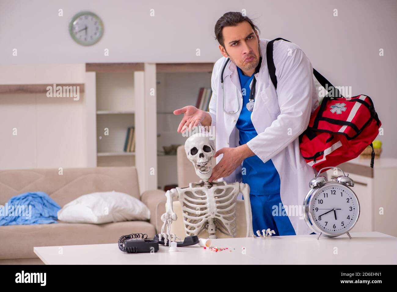Male paramedic visiting skeleton patient Stock Photo - Alamy