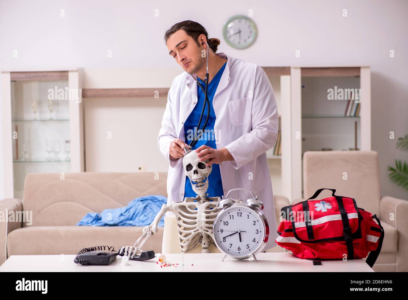 Male paramedic visiting skeleton patient Stock Photo - Alamy