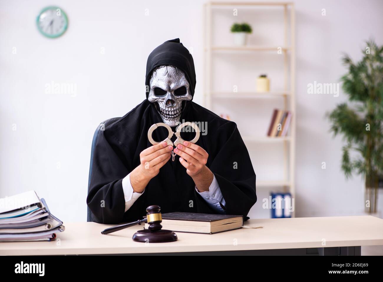 Devil judge working in the courthouse Stock Photo - Alamy