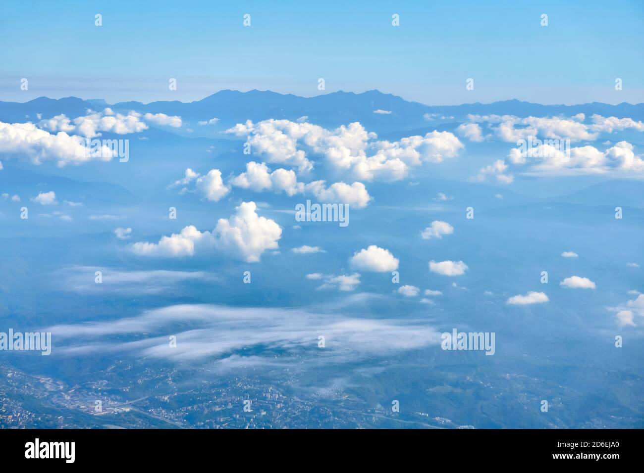 view of the clouds and mountain peaks on the horizon from a great ...