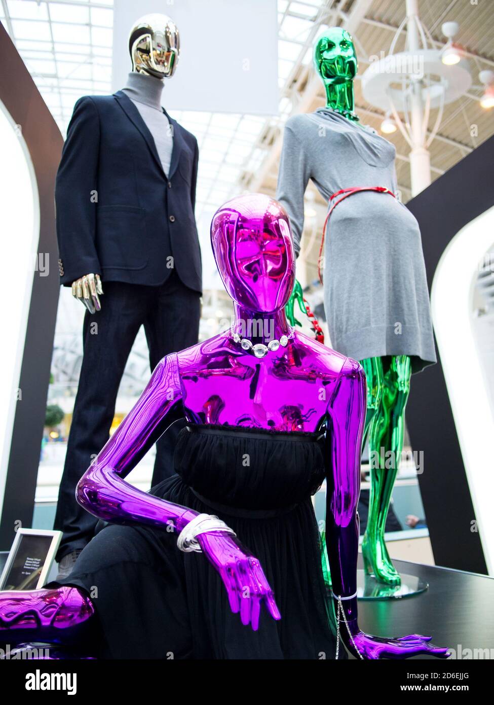 Three mannequins advertising fashion in a shopping mall Stock Photo - Alamy
