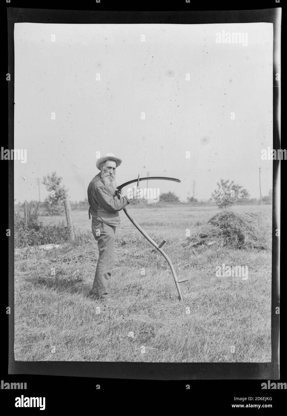 Hand holding a sickle Black and White Stock Photos & Images - Alamy