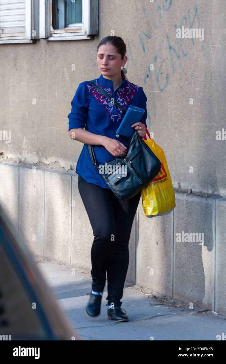 Timisoara, Romania - June 06, 2017: Woman walking on the street. Real ...
