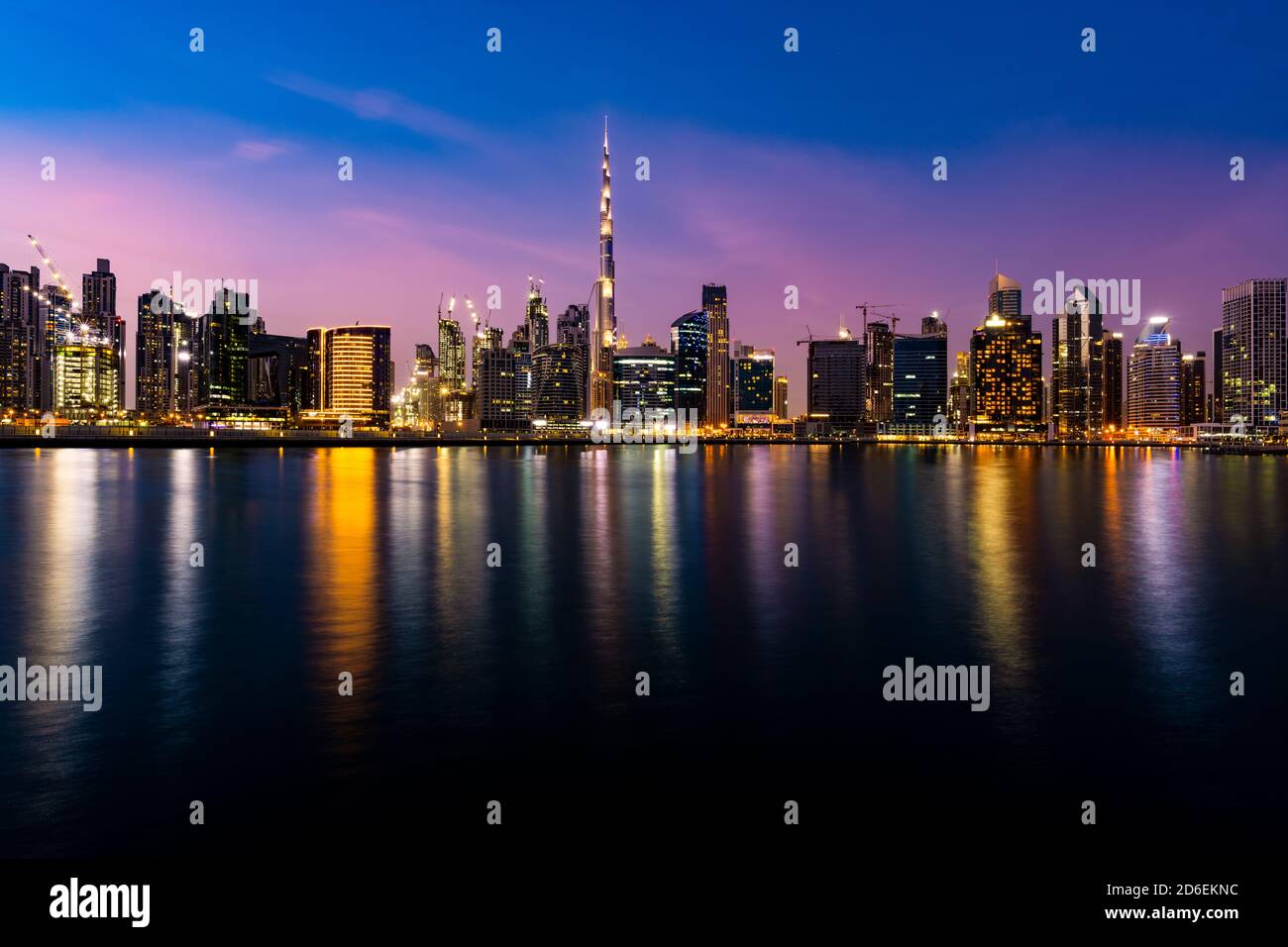 Stunning view of the illuminated Dubai skyline at dusk with modern ...