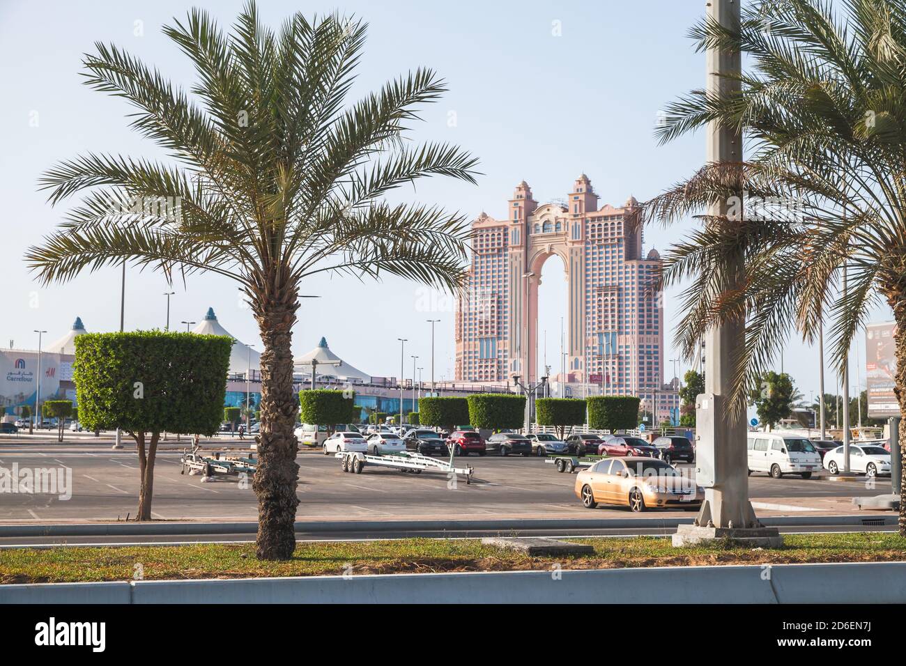 Abu Dhabi, United Arab Emirates - April 9, 2019: Street view with palm ...
