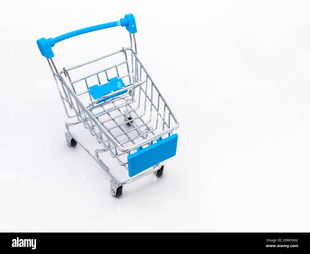 Mini empty grocery cart isolated on white background Stock Photo - Alamy