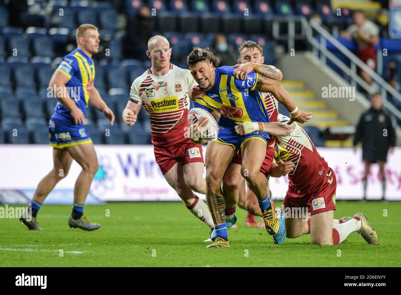 Anthony Gelling of Warrington Wolves skips through Wigan Warriors line ...