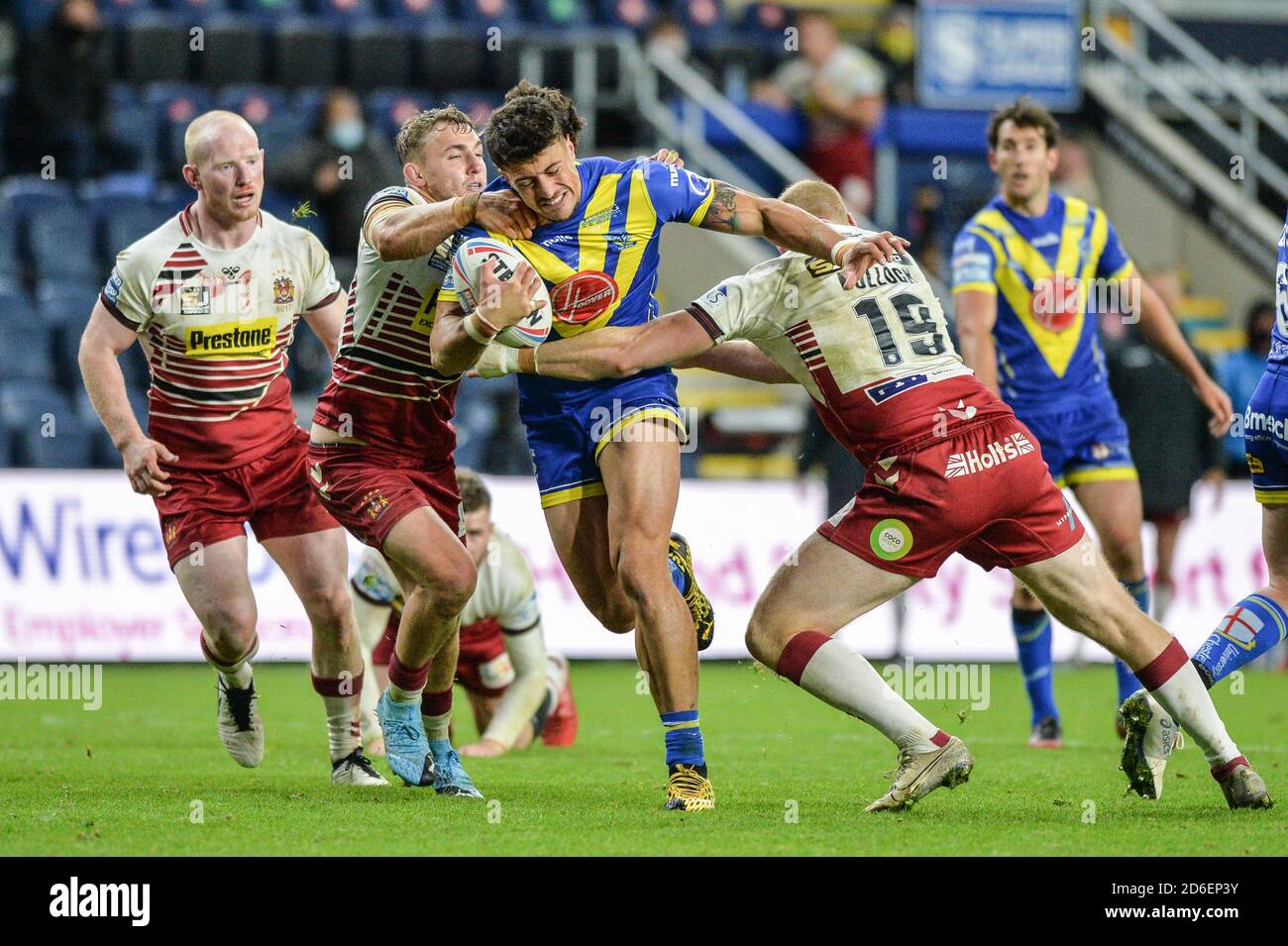 Anthony Gelling of Warrington Wolves brought down by Sam Powell and Joe ...