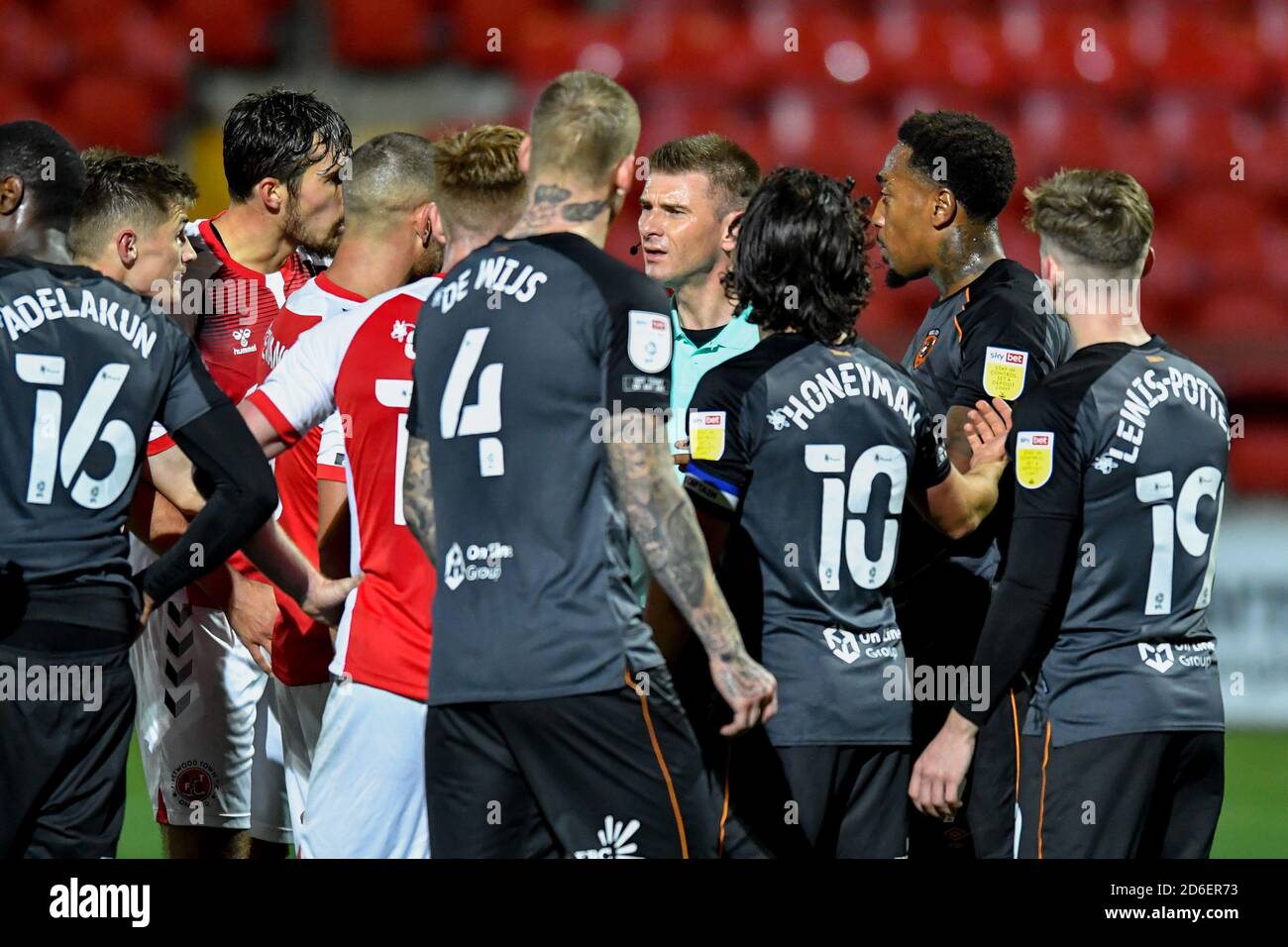 The players of both teams surround the referee Stock Photo - Alamy