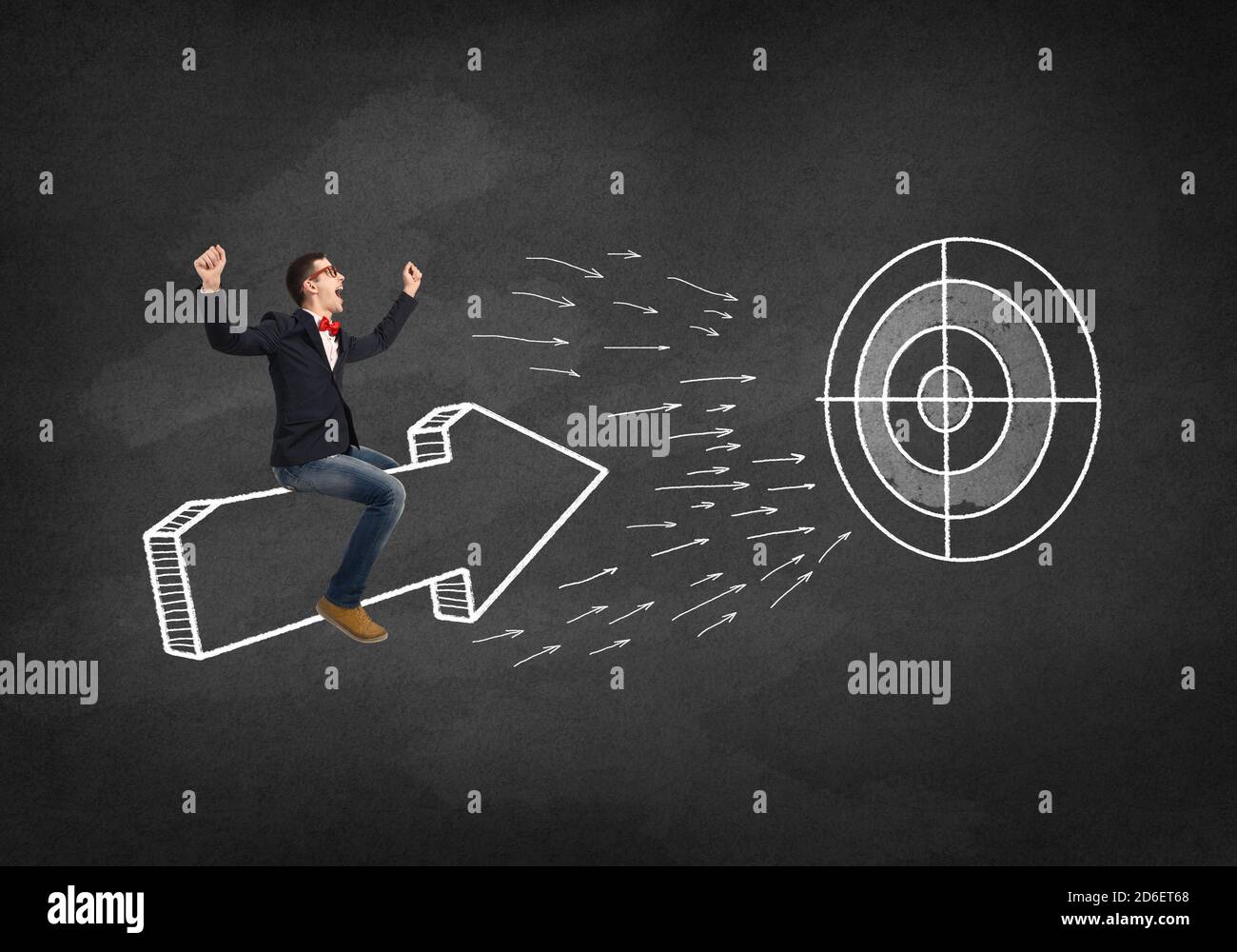 Man riding drawn arrow Stock Photo - Alamy