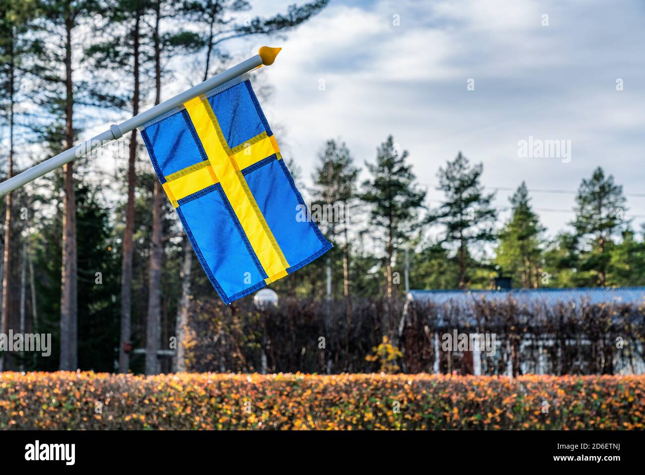 Close up view of Swedish flag with flagpole slowly waving in calm ...