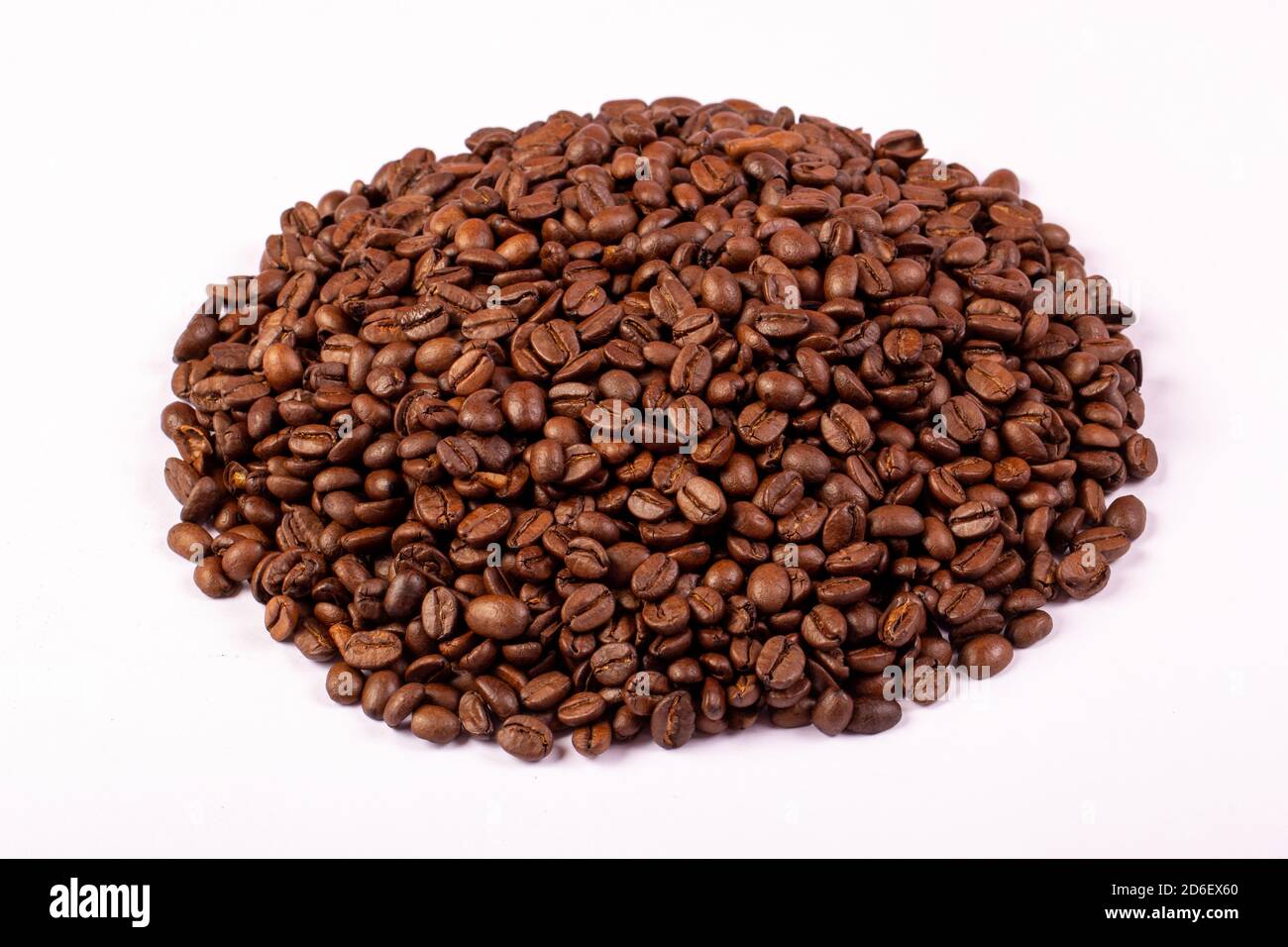 Coffee beans on a light background. Roasted coffee Stock Photo - Alamy