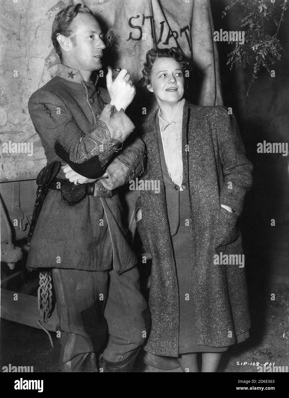 LESLIE HOWARD and Technical Advisor SUSAN MYRICK on set candid during ...