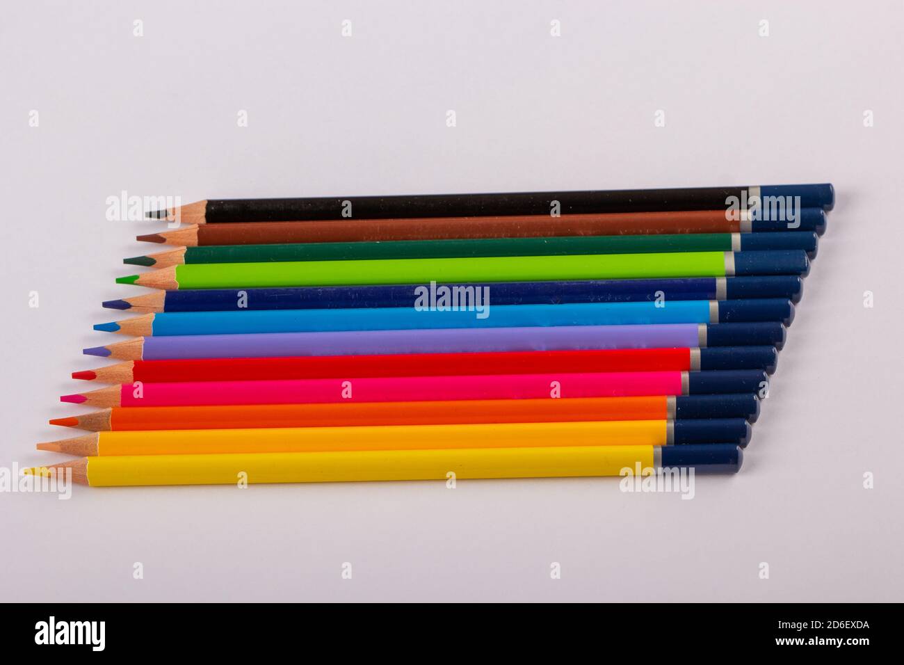 Stacked colored pencils on a light background. Side view Stock Photo ...