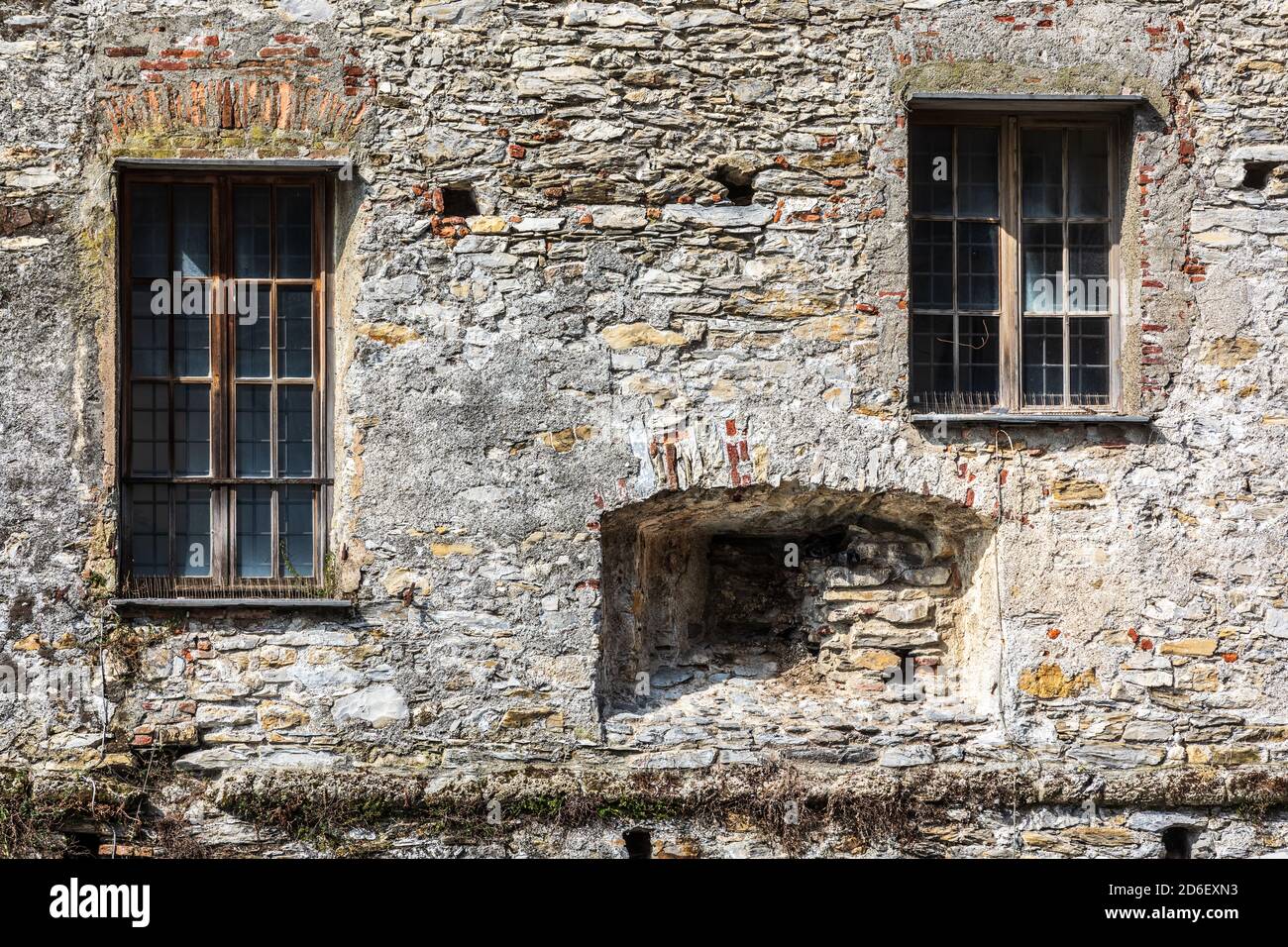 Historic house built in ancient bricks with windows and loopholes ...