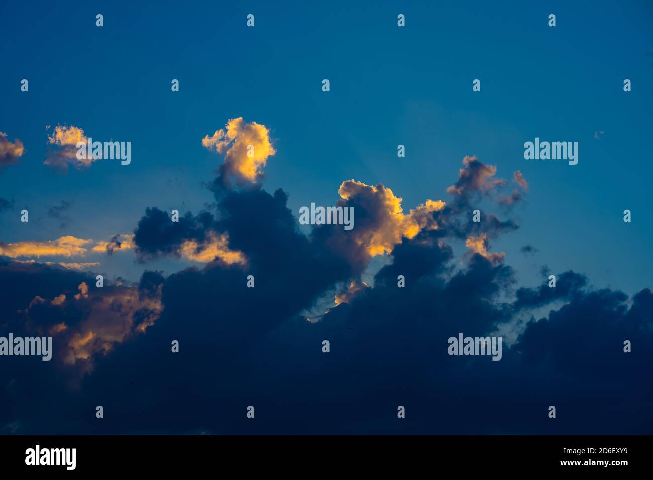 Heavy cloudy sky at sunset. A landscape of beautiful nature Stock Photo ...