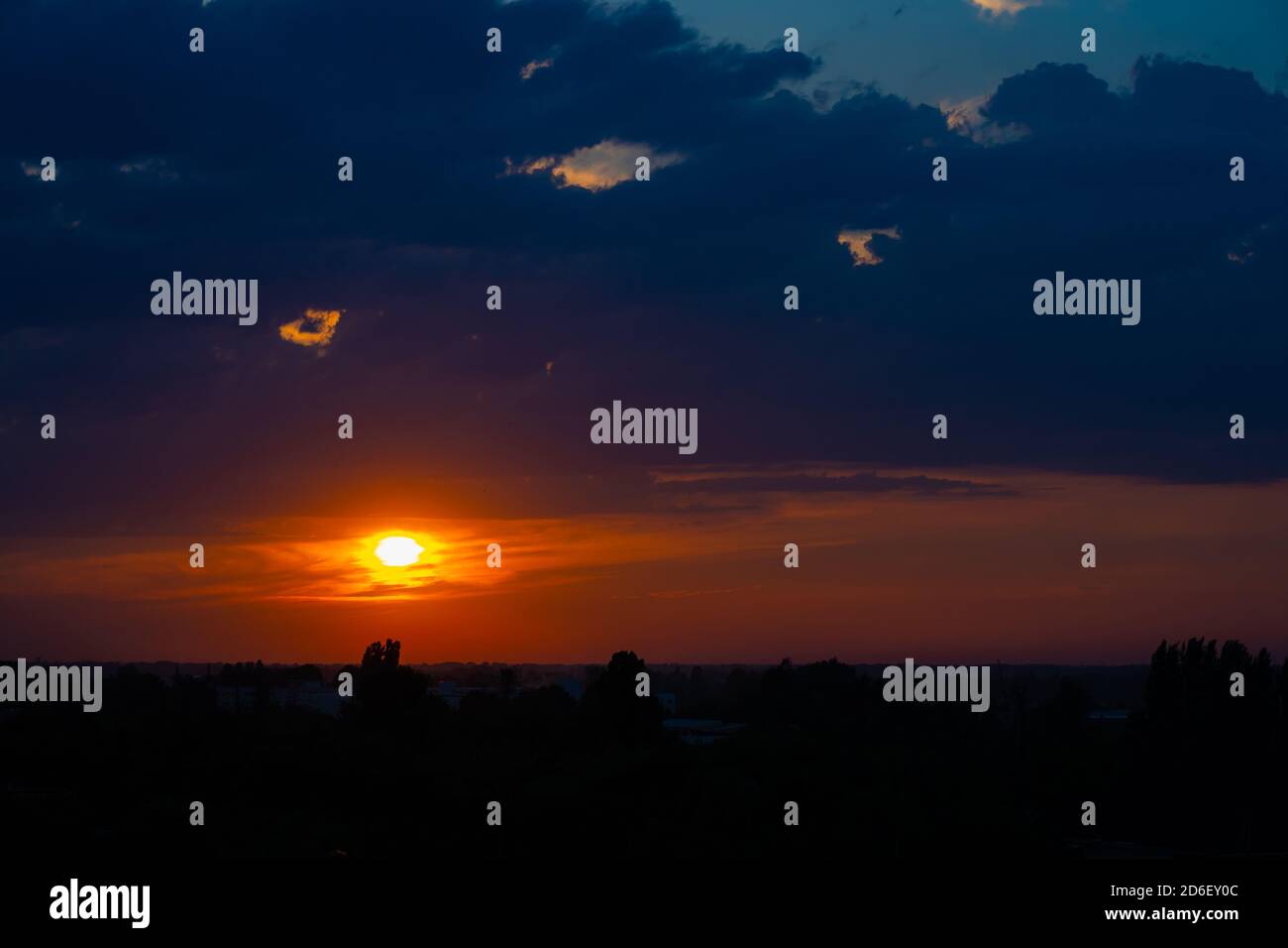 Heavy cloudy sky at sunset. A landscape of beautiful nature Stock Photo ...